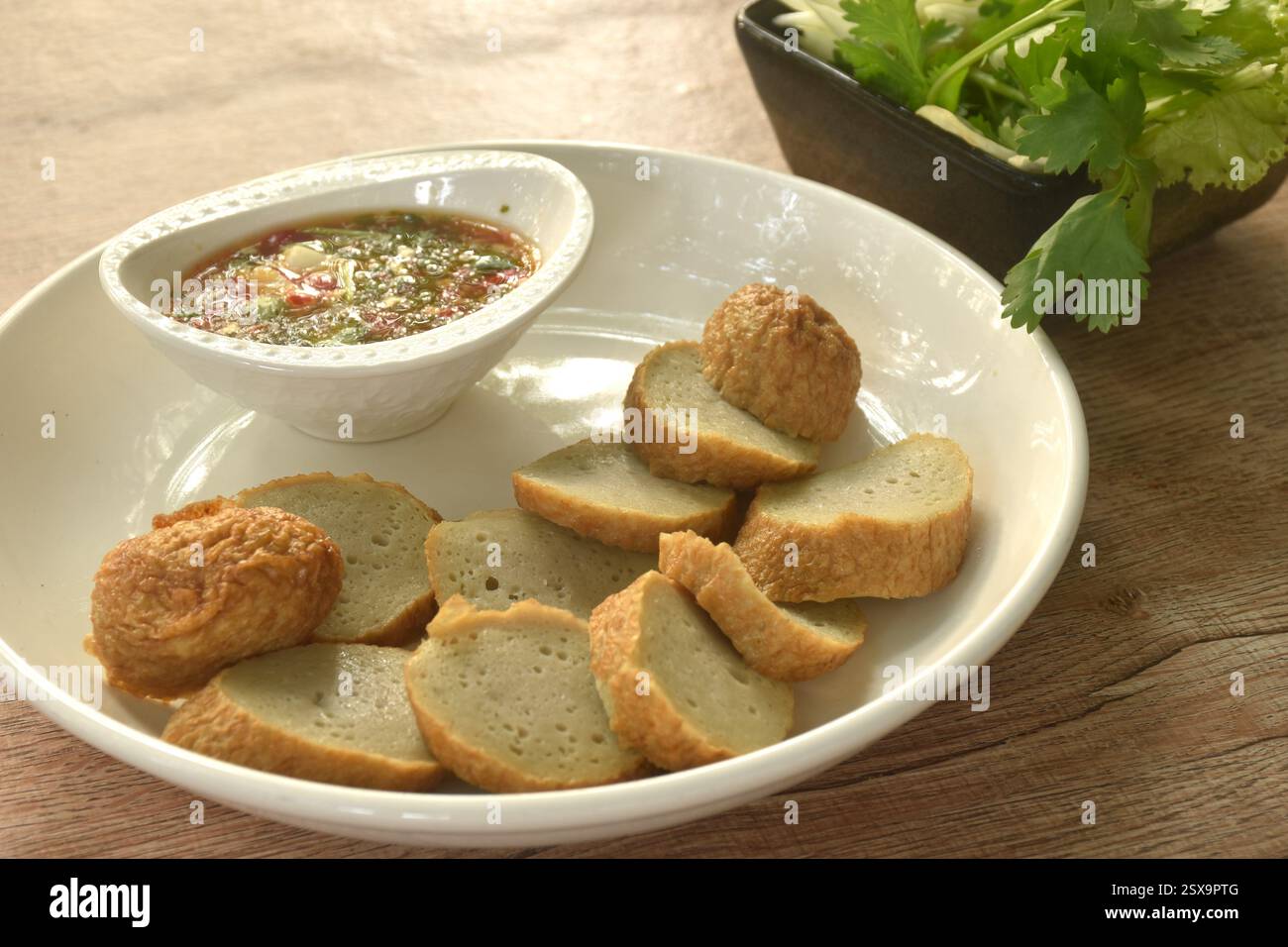 slice steamed fish line on plate dipping spicy sour chili sauce eat ...