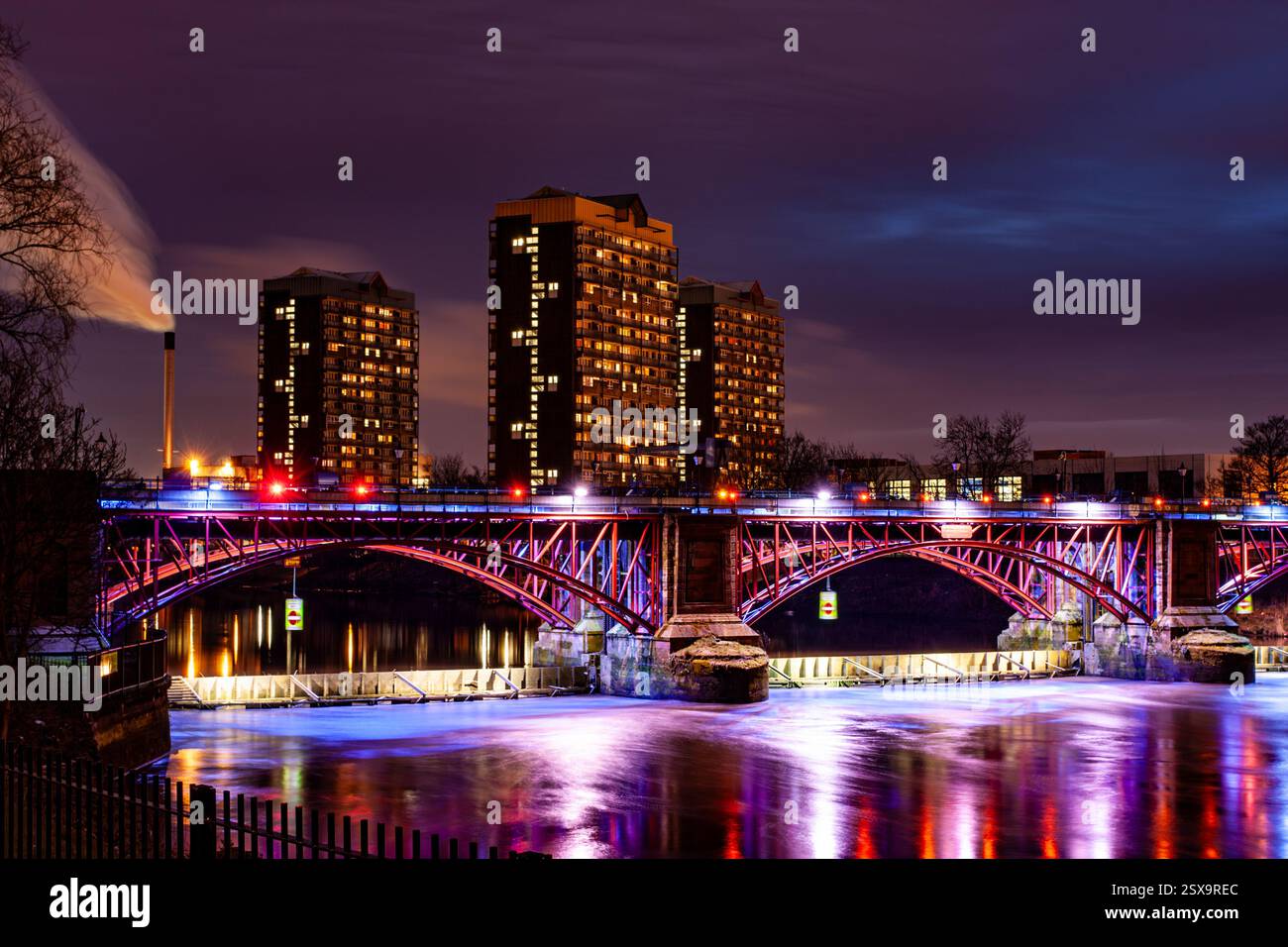 Vivid colours at dusk on River Clyde with the Pipe Bridge & Tidal Weir ...