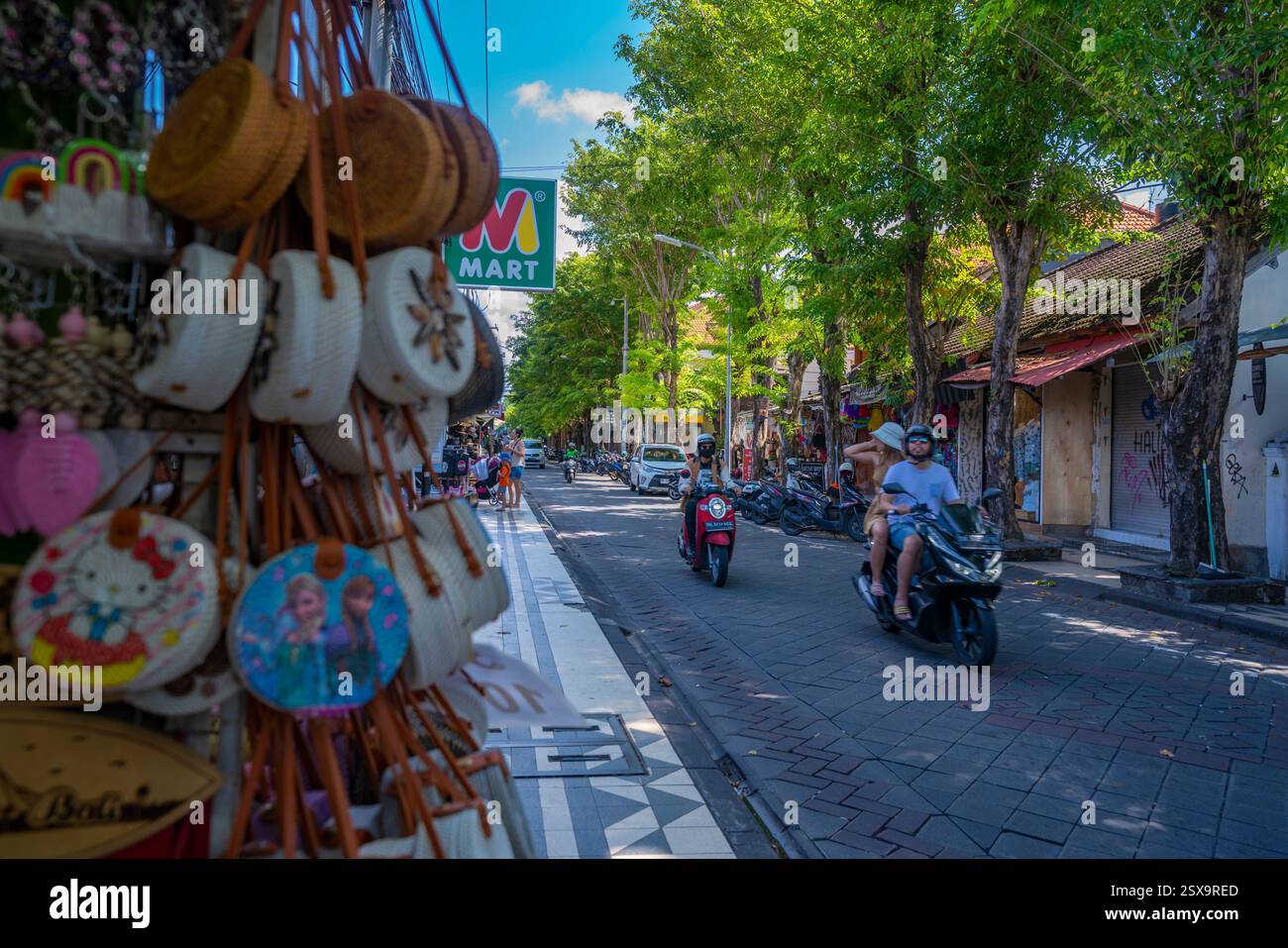 View of shops and motorcycles on street in Kuta, Kuta, Bali, Indonesia ...