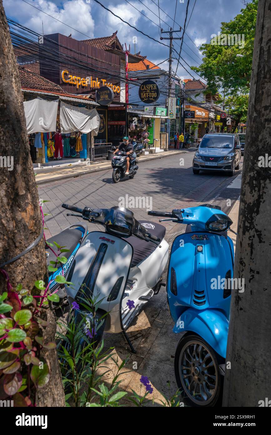 View of shops and motorcycles on street in Kuta, Kuta, Bali, Indonesia ...