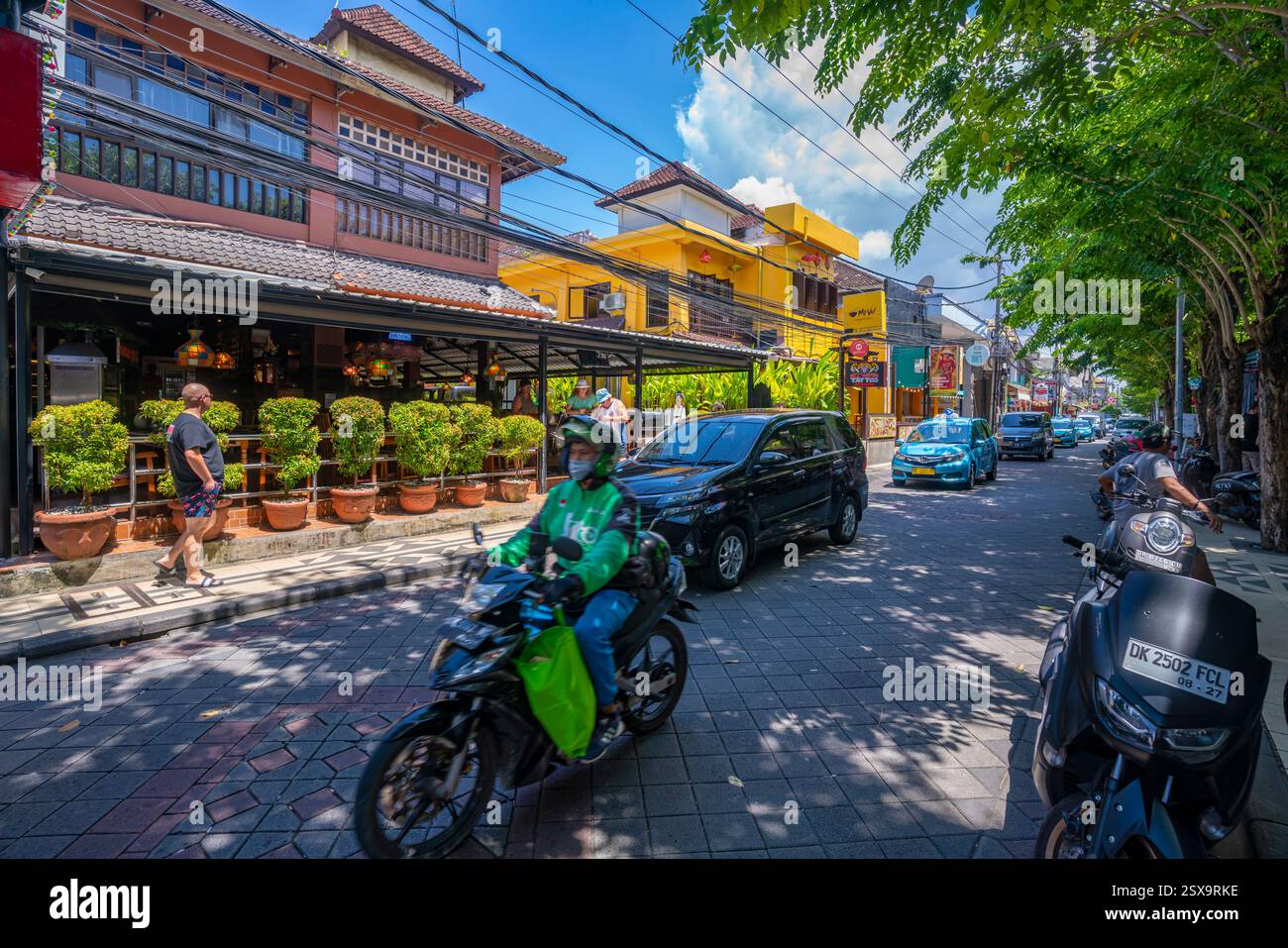 View of shops and motorcycles on street in Kuta, Kuta, Bali, Indonesia ...