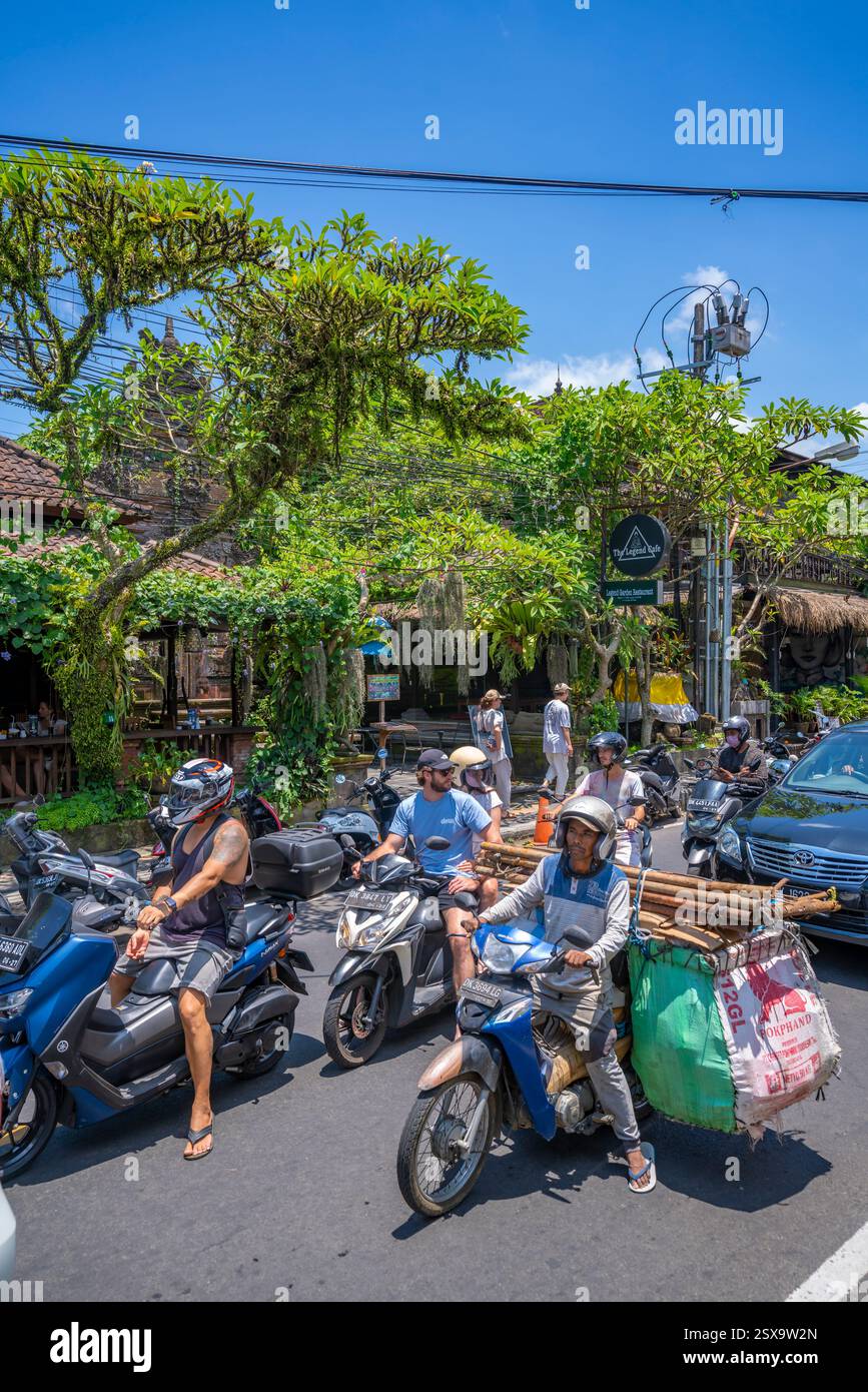 View of busy street lined with cafes and restaurants in Ubud, Ubud ...
