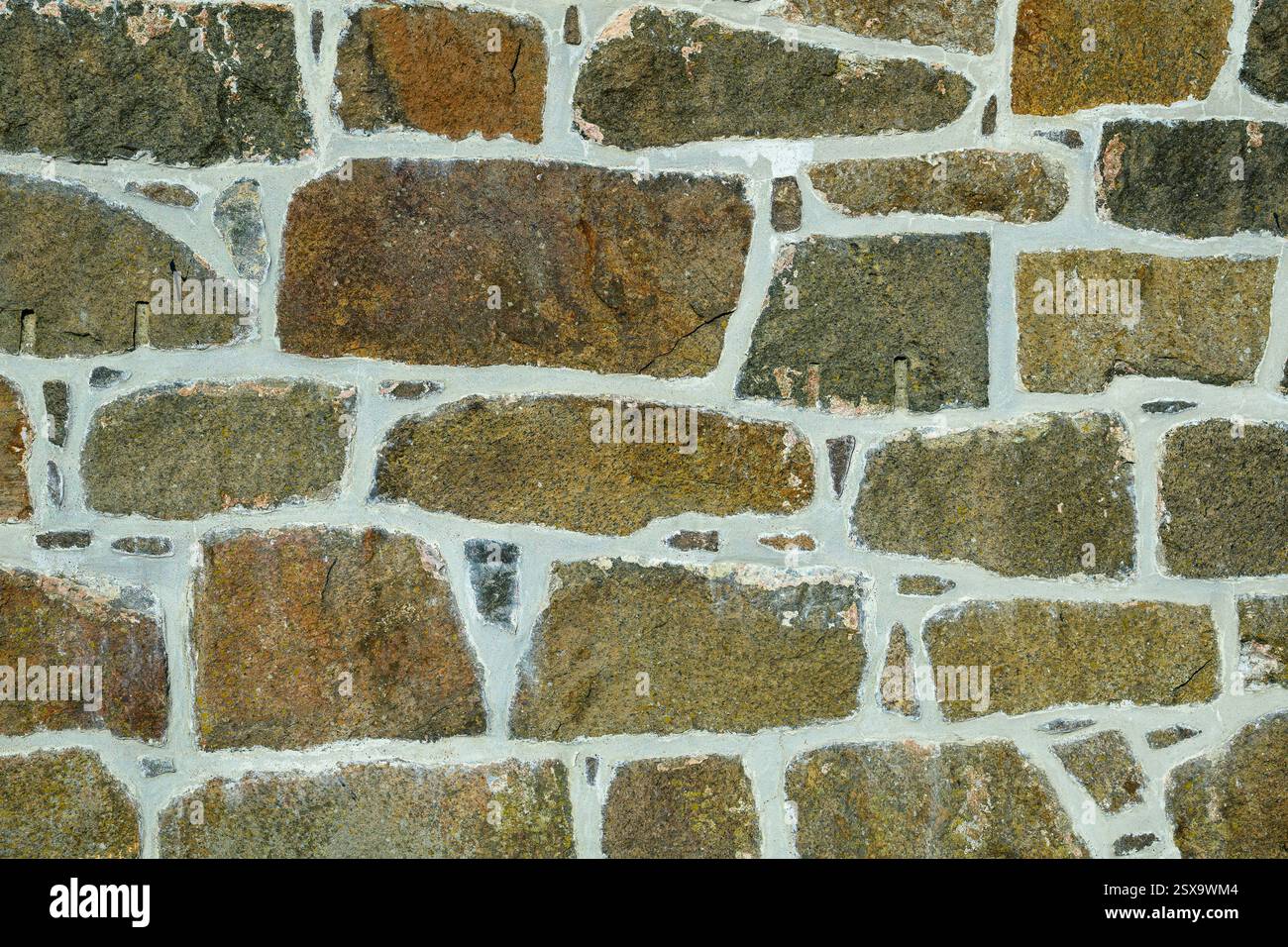 This structure features a rustic stone wall showcasing a blend of ...