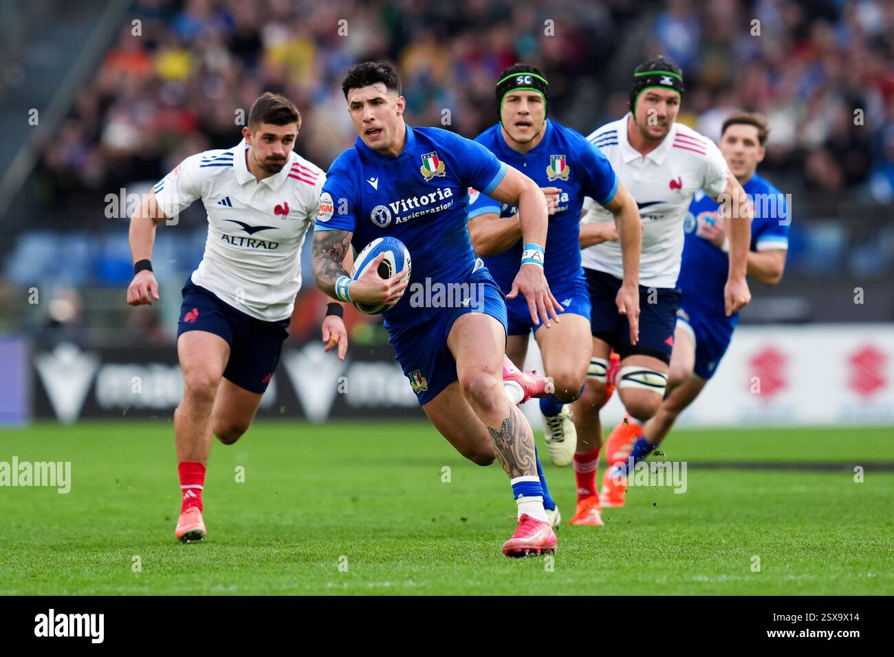 Rome, Italy. 23rd Feb, 2025. Tommaso Menoncello of Italy runs to score ...