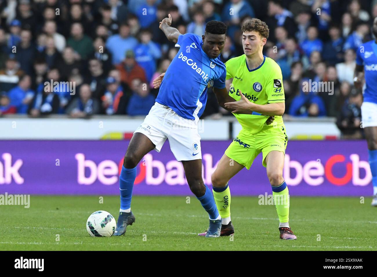 Genk's Ibrahima Bangoura and Gent's Mathias Delorge pictured in action ...