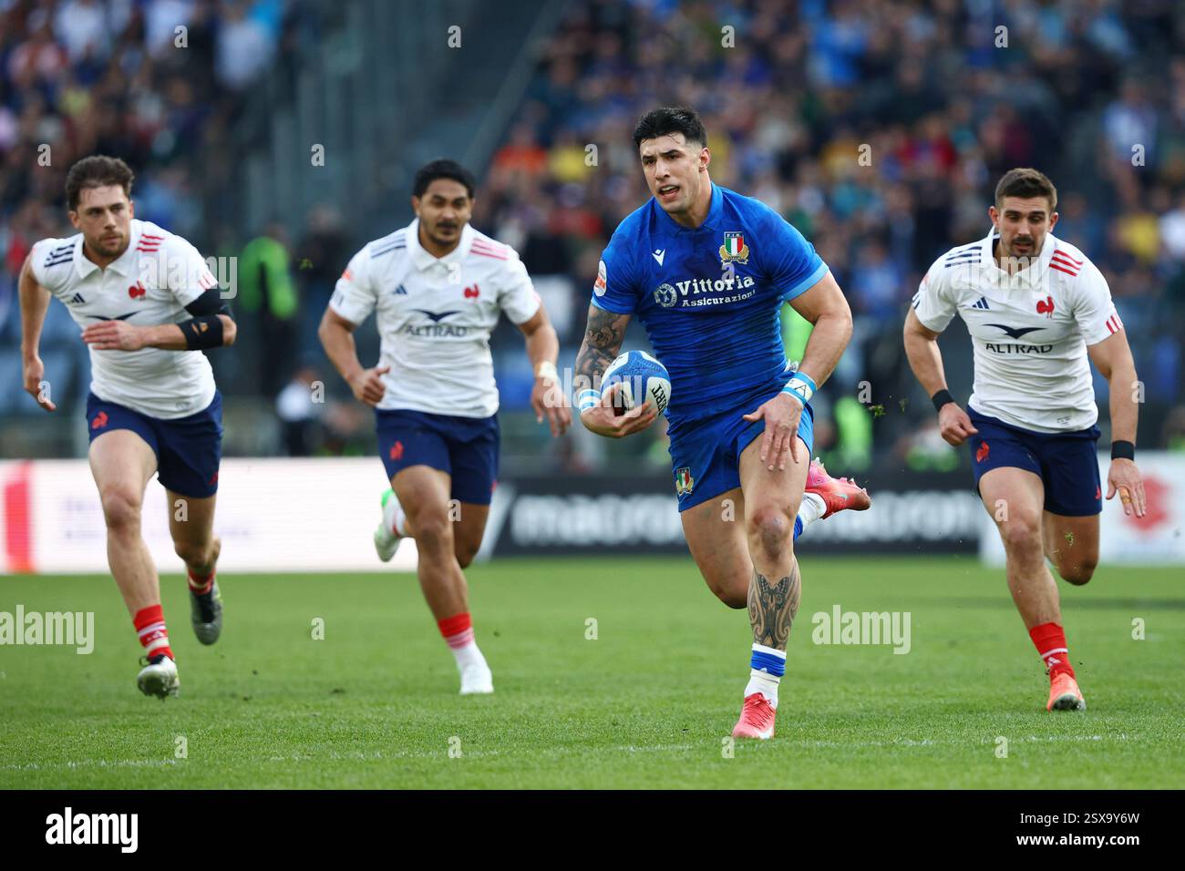 Rome, Italy. 23th Feb, 2025. Tommaso Menoncello of Italy runs in a try ...