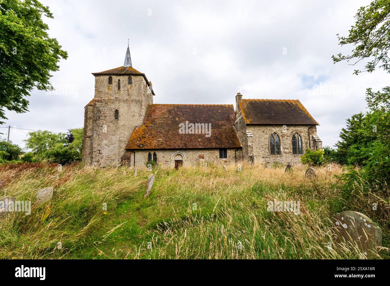 Norman 12th century stone church of St Mary Magdalene, with a pyramidal ...
