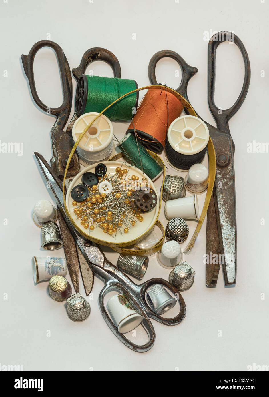 Steel scissors, Thimbles in small wooden treasure chest, Spools of ...