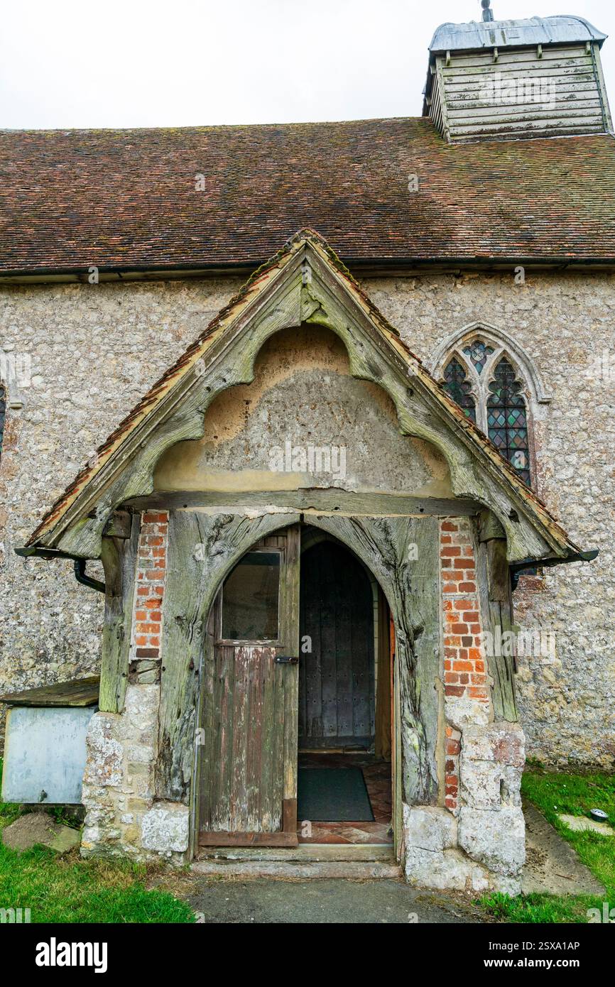 Front view of the stone, brick and wooden medieval porch of the 12th ...