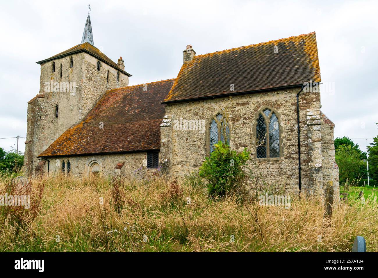 Norman 12th century stone church of St Mary Magdalene, with a pyramidal ...