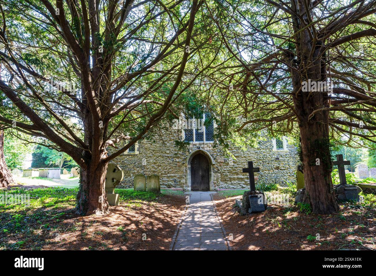 Stone pathway leading through church yard with graves and flanked by ...
