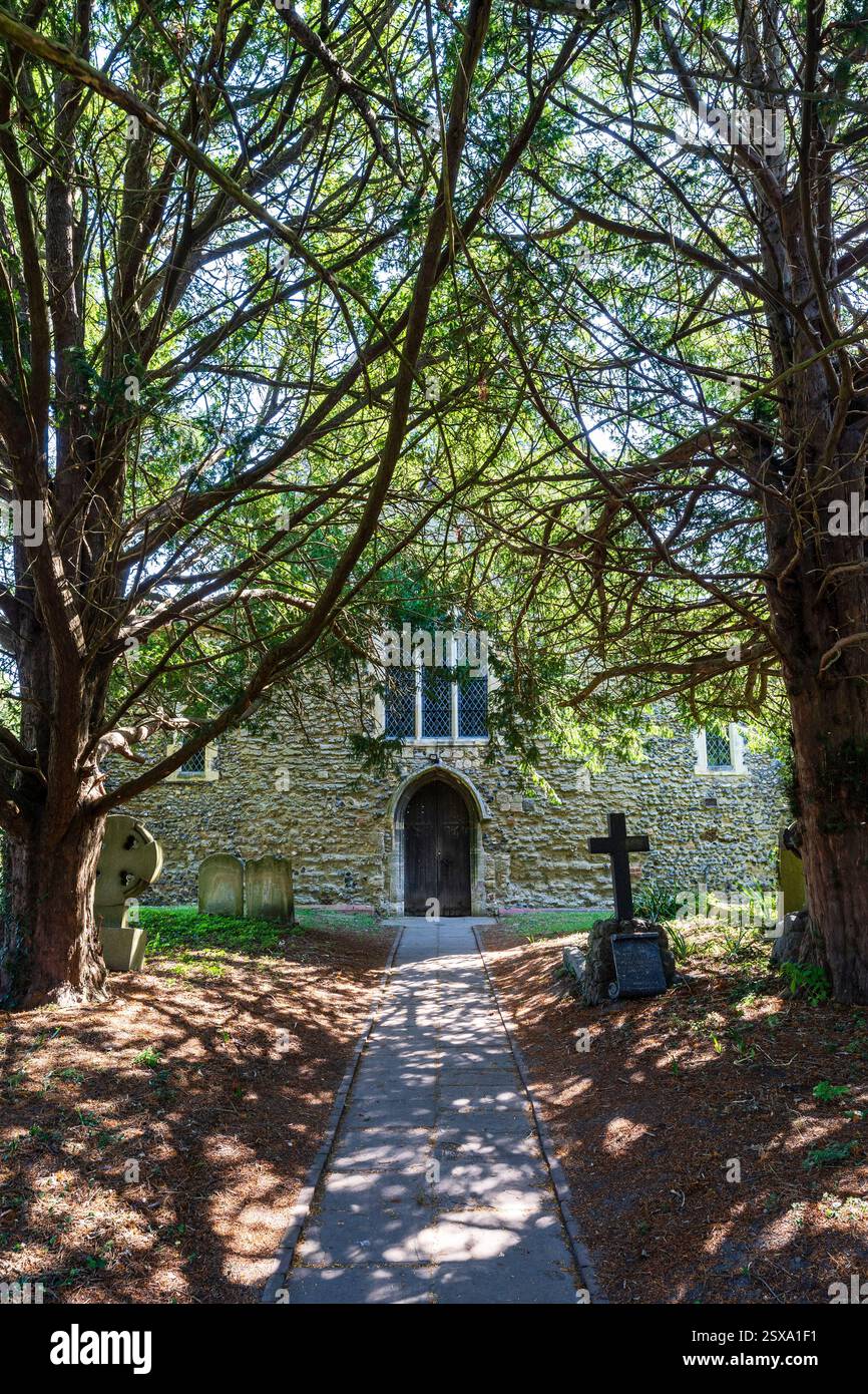 Stone pathway leading through church yard with graves and flanked by ...
