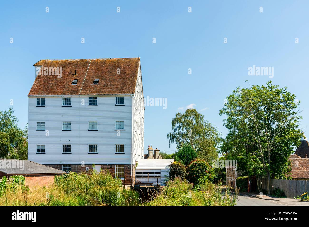 Tall white clapboard water mill in Wickhambreaux, Kent. Constructed as ...