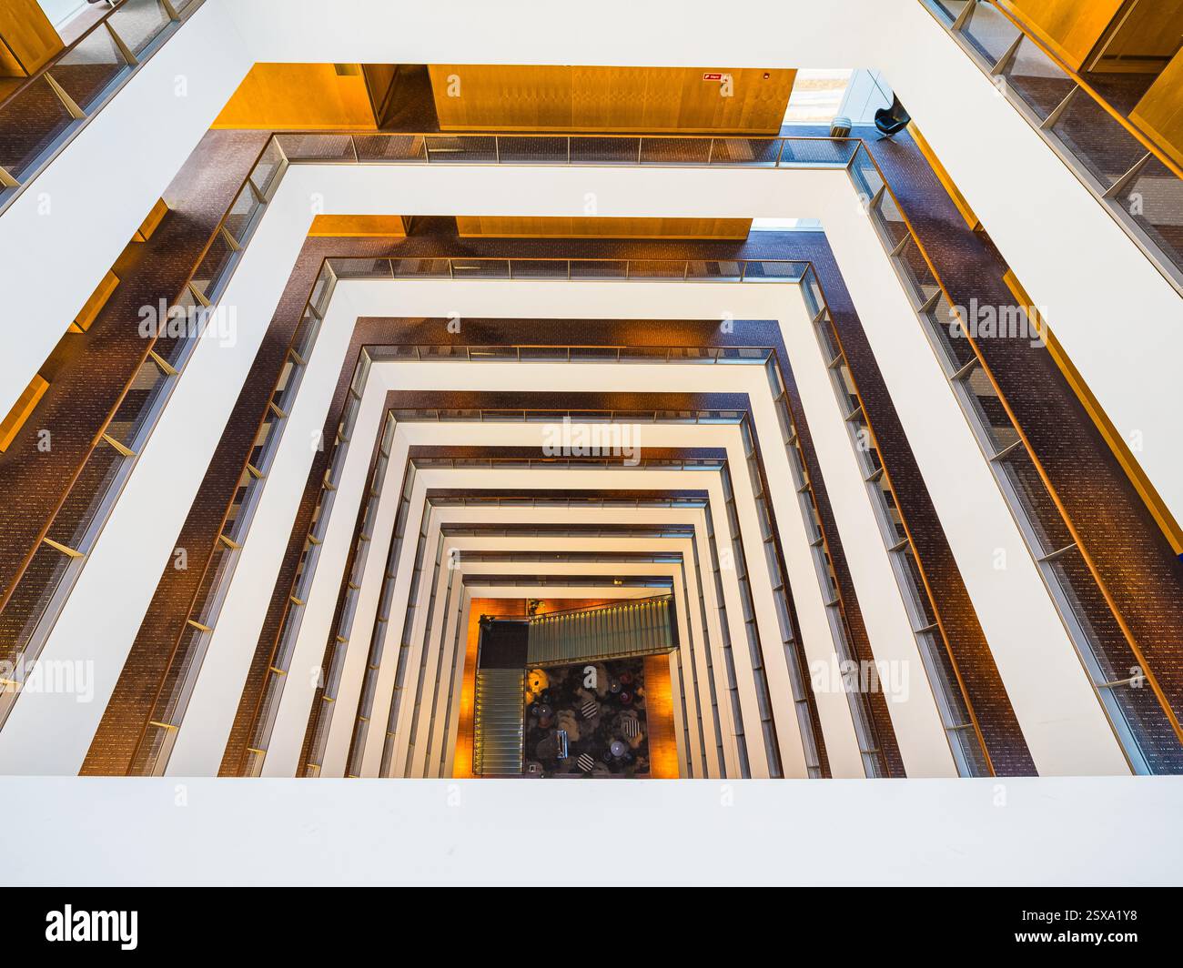 The hotel features a striking geometric design with multiple floors and ...