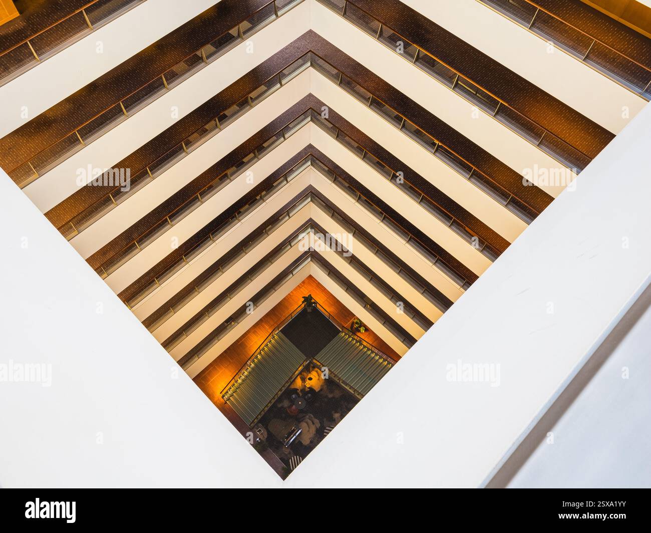 The hotel features a striking geometric design with multiple floors and ...