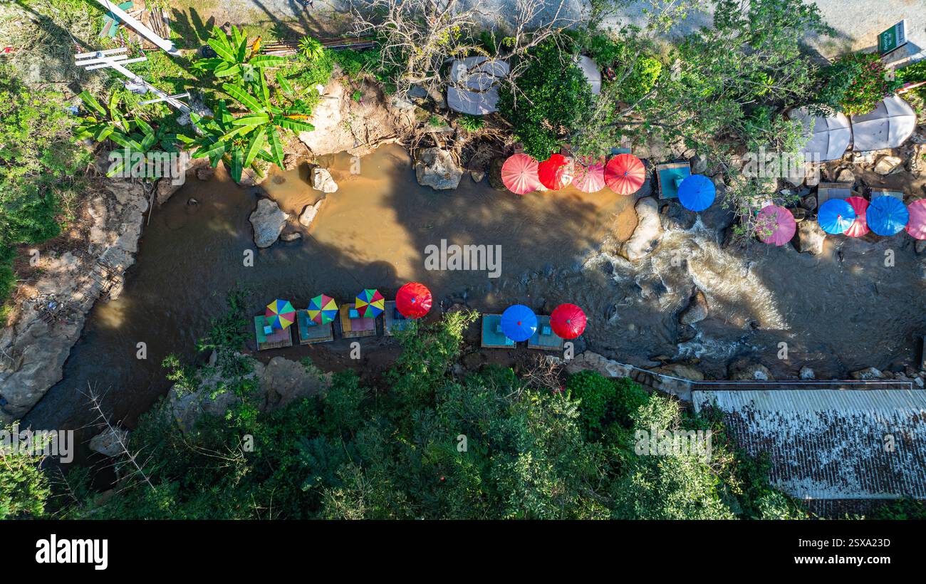 Amazing bird's eye view of a riverside restaurant with colorful ...