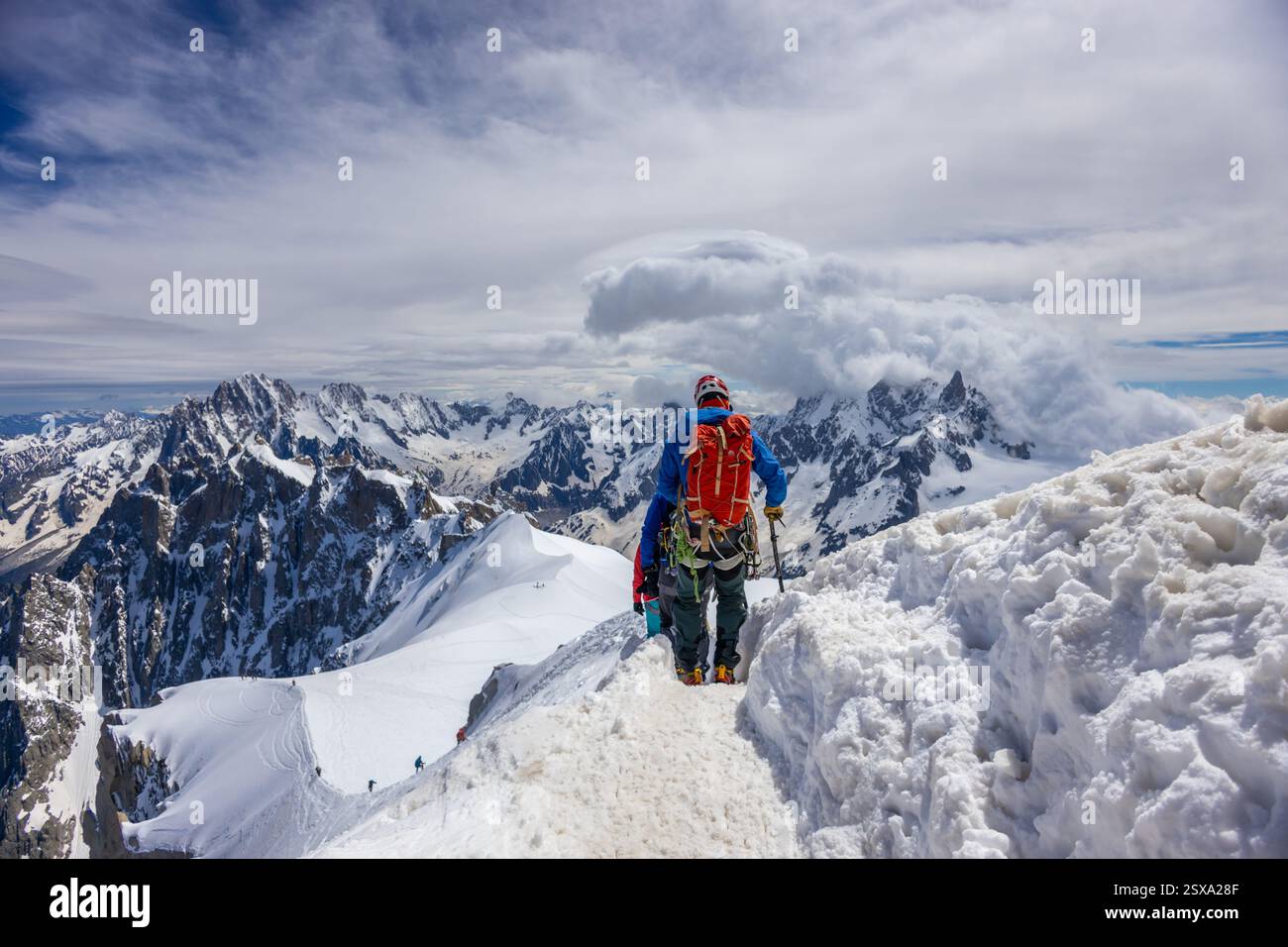 Alpine climbers rope team on a glacier in Chamonix valley training the ...
