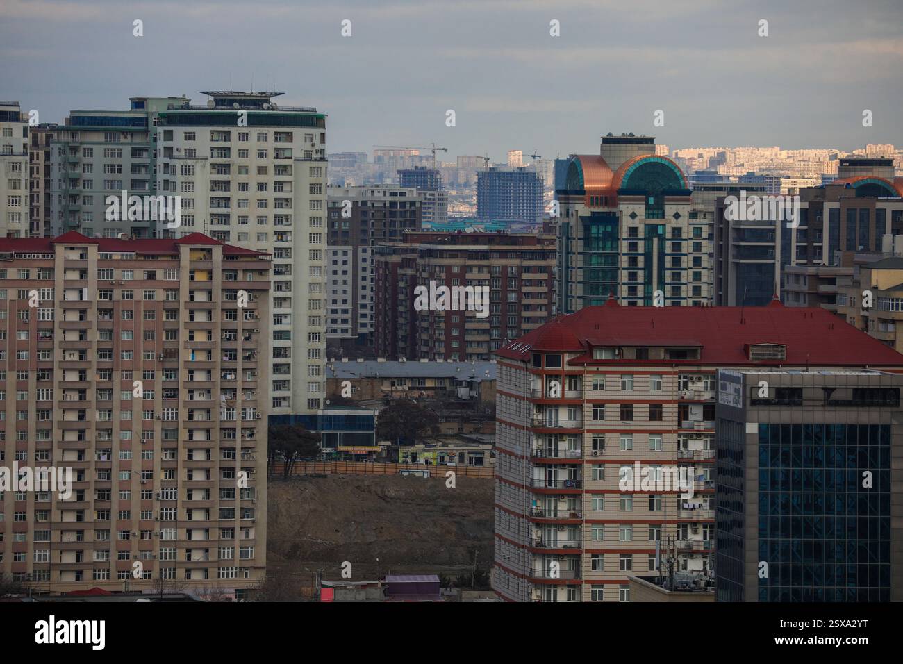 General view of Soviet buildind and modern building in center of Baku ...