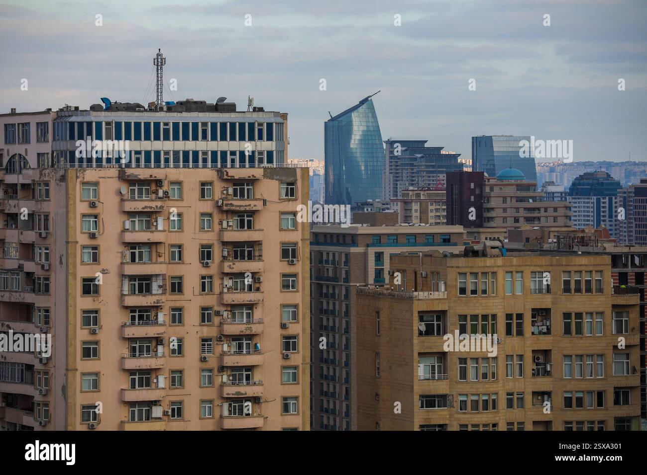 General view of Soviet buildind and modern building in center of Baku ...