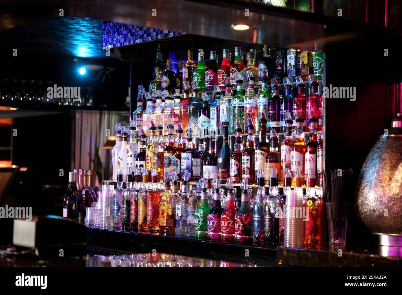 General views of alcoholic drinks and bottles of spirits behind a bar ...