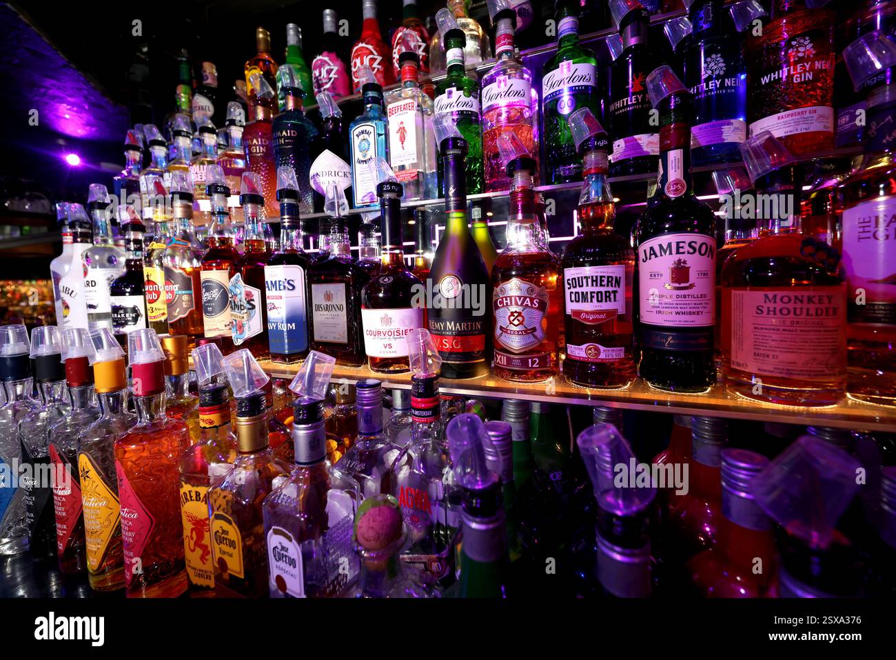 General views of alcoholic drinks and bottles of spirits behind a bar ...