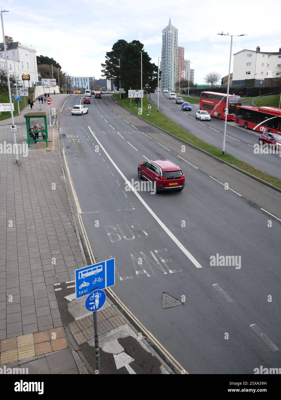 A bus lane with bus stop in quality bus corridor prioritising bus ...