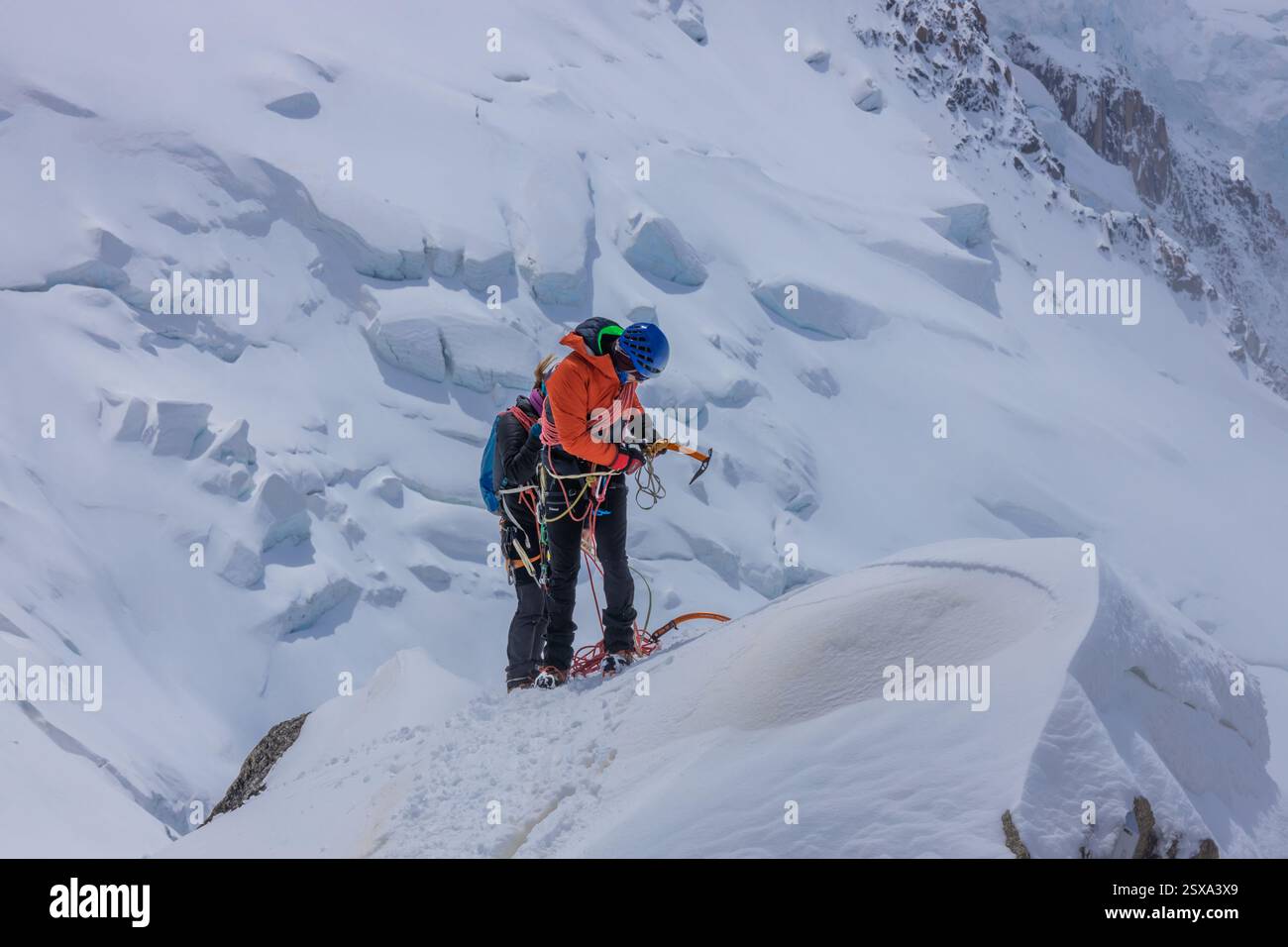 Alpine climbers rope team on a glacier in Chamonix valley training the ...