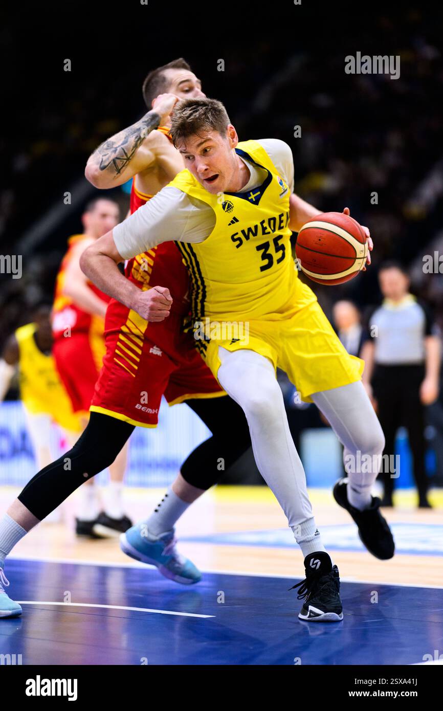 250223 Nemanja Radovic of Montenegro and Simon Birgander of Sweden during the FIBA Eurobasket ...