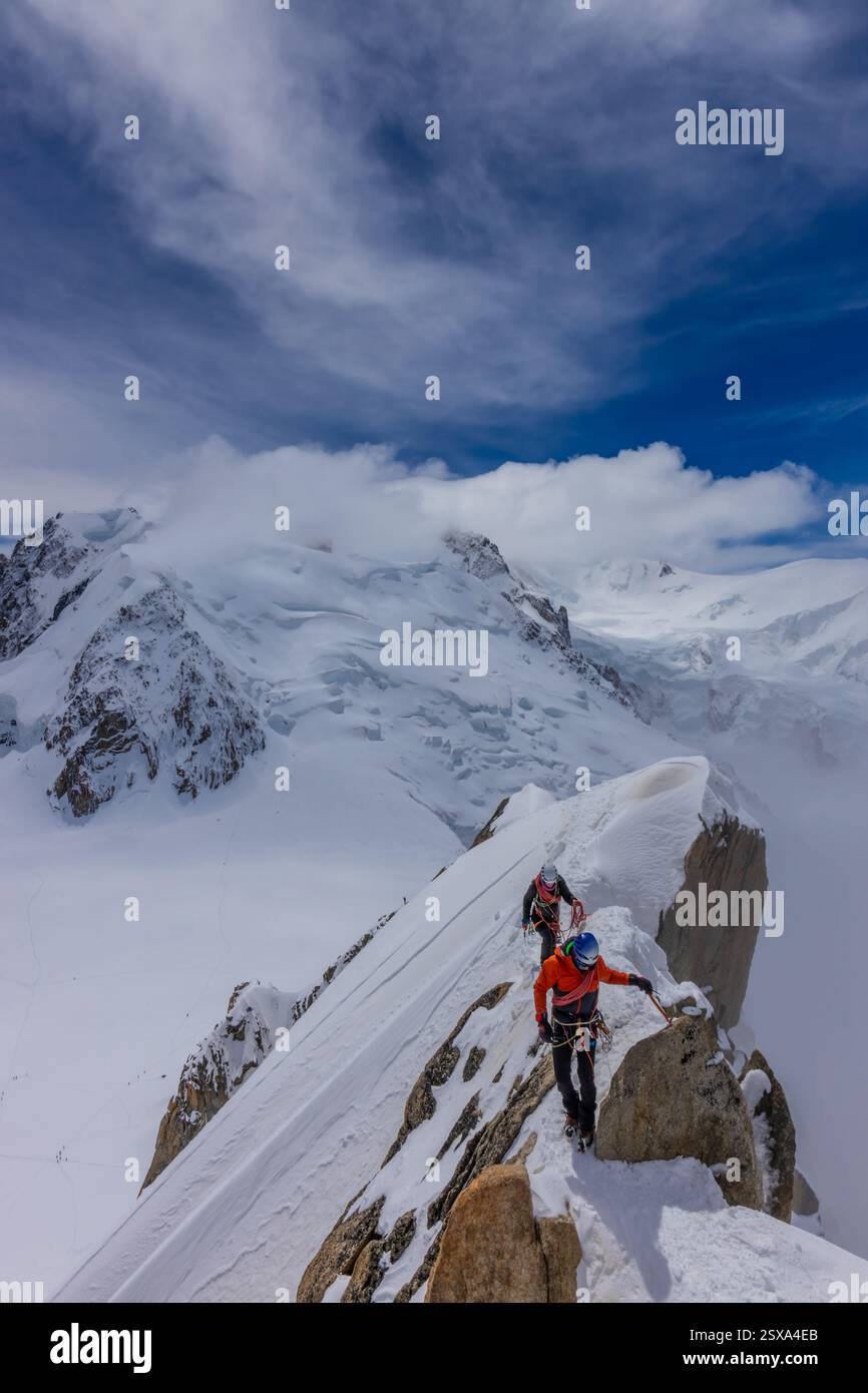 Alpine climbers rope team on a glacier in Chamonix valley training the ...
