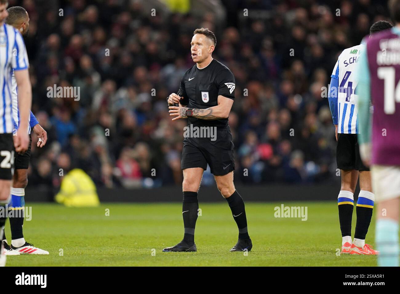 Burnley, UK. 21st Feb, 2025. Referee Stephen Martin during the Burnley ...
