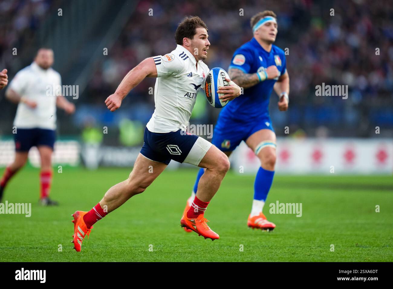 Rome, Italy. 23rd Feb, 2025. Antoine Dupont of France runs to score a try during the Guinness ...