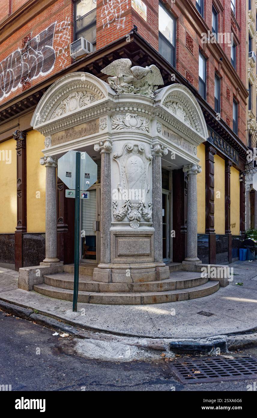 An elaborate cast iron storefront inset with stone and terra cotta at ...