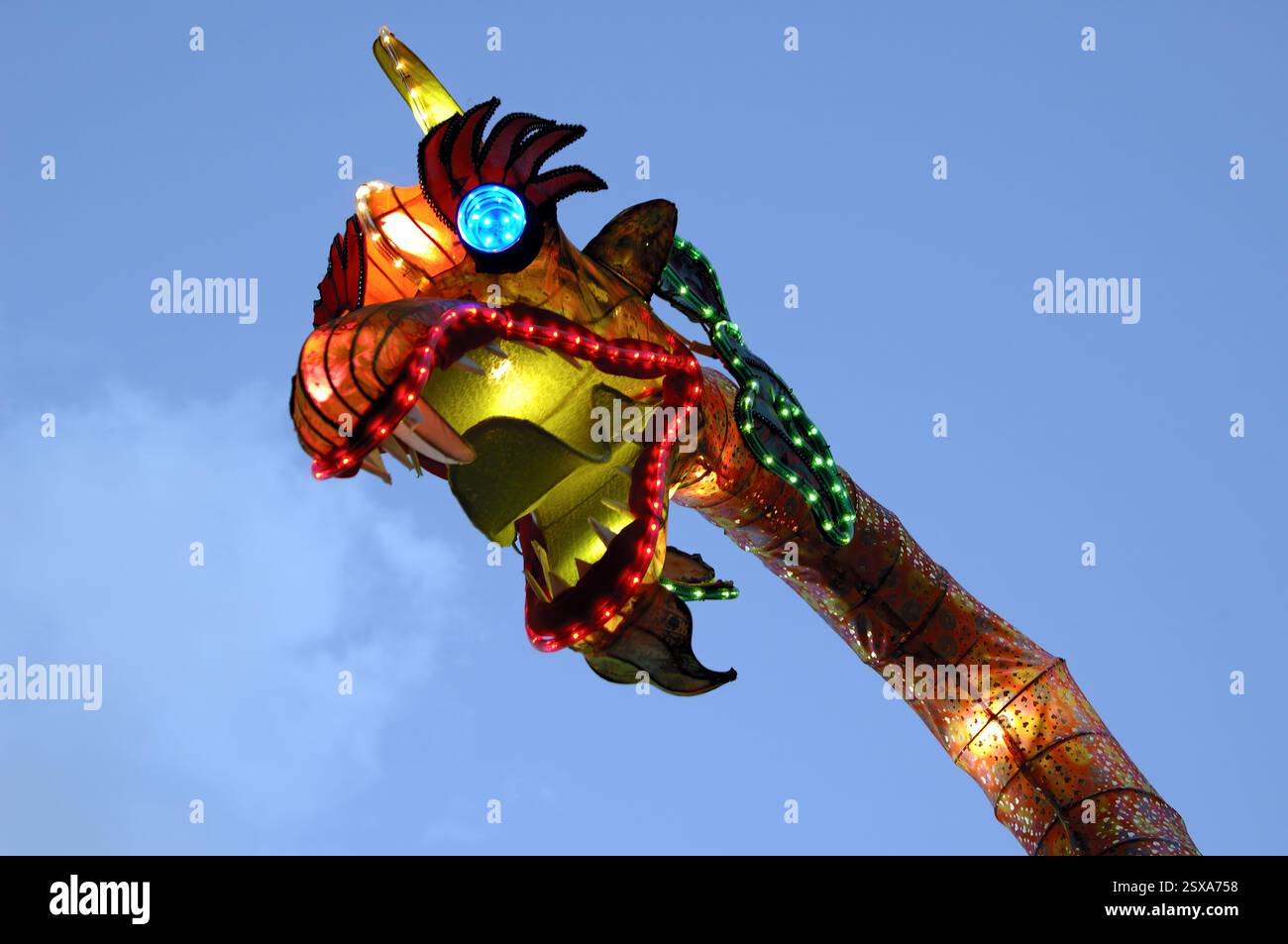 A flexible giant puppet made of bamboo and paper in shape of a dragon ...