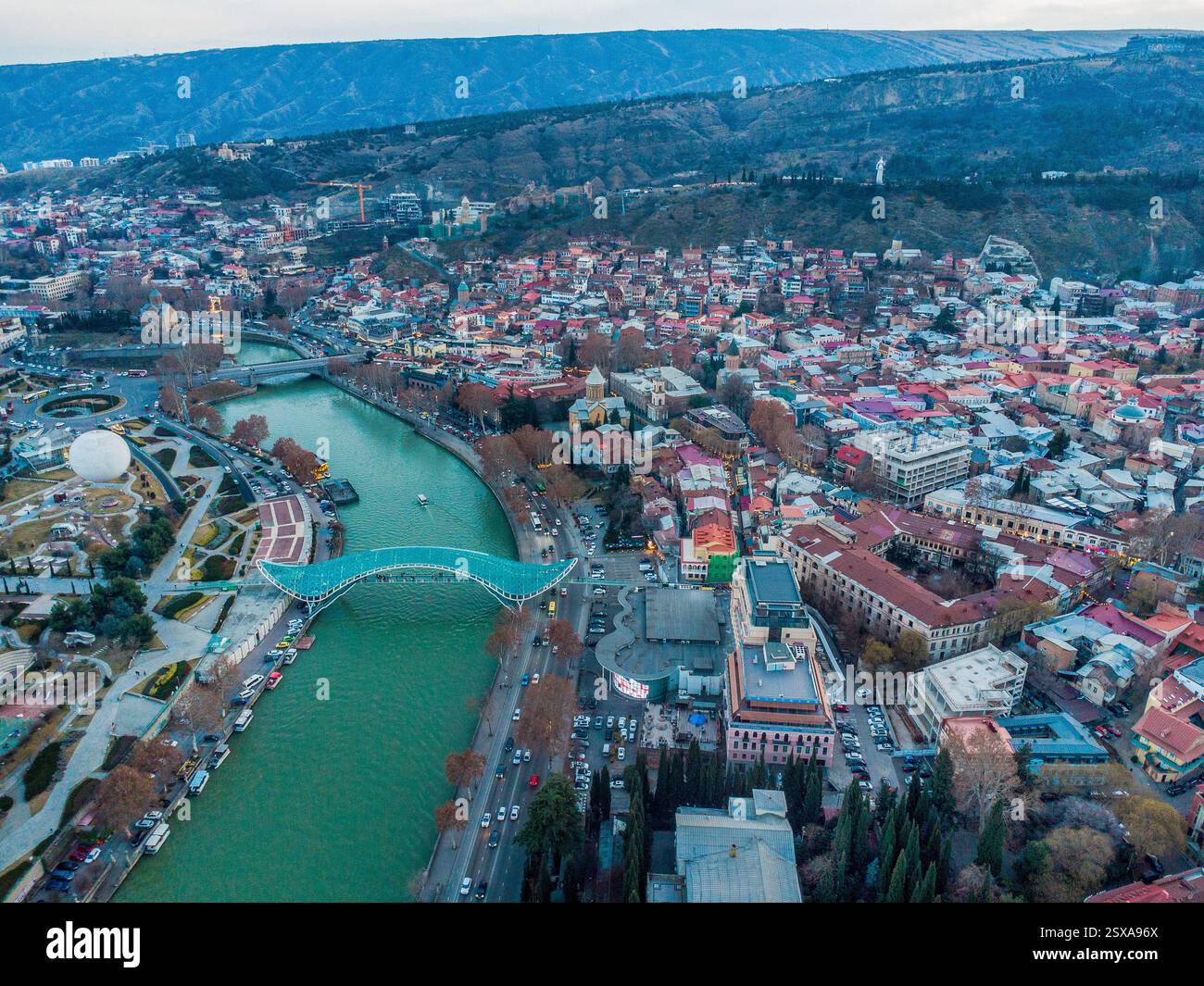 Drone point of view . WINTER in Tbilisi: Kura river flow and bridge of ...