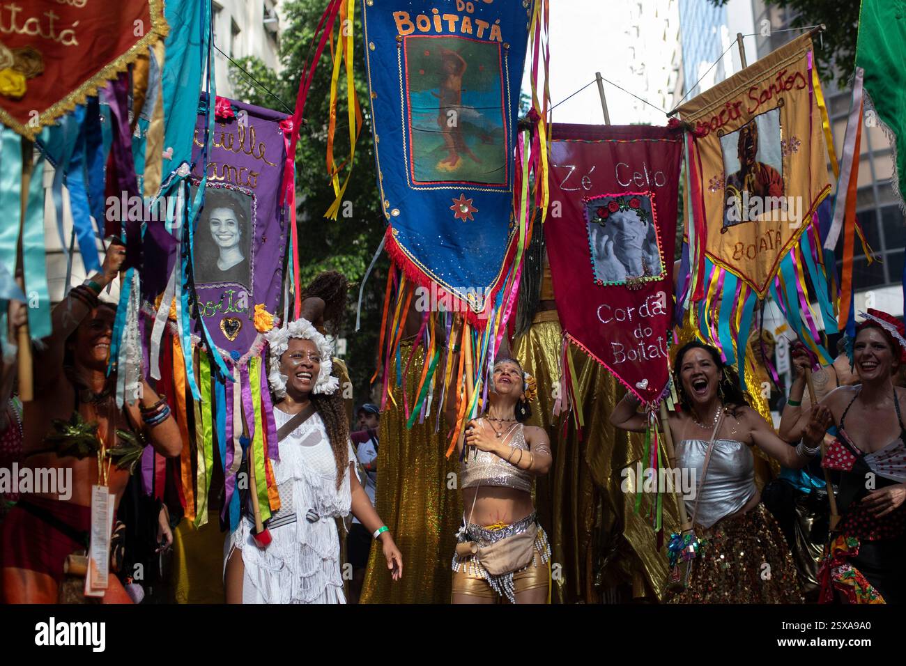 Revelers dance at the "Cordao do Boitata" street pre-carnival party in ...
