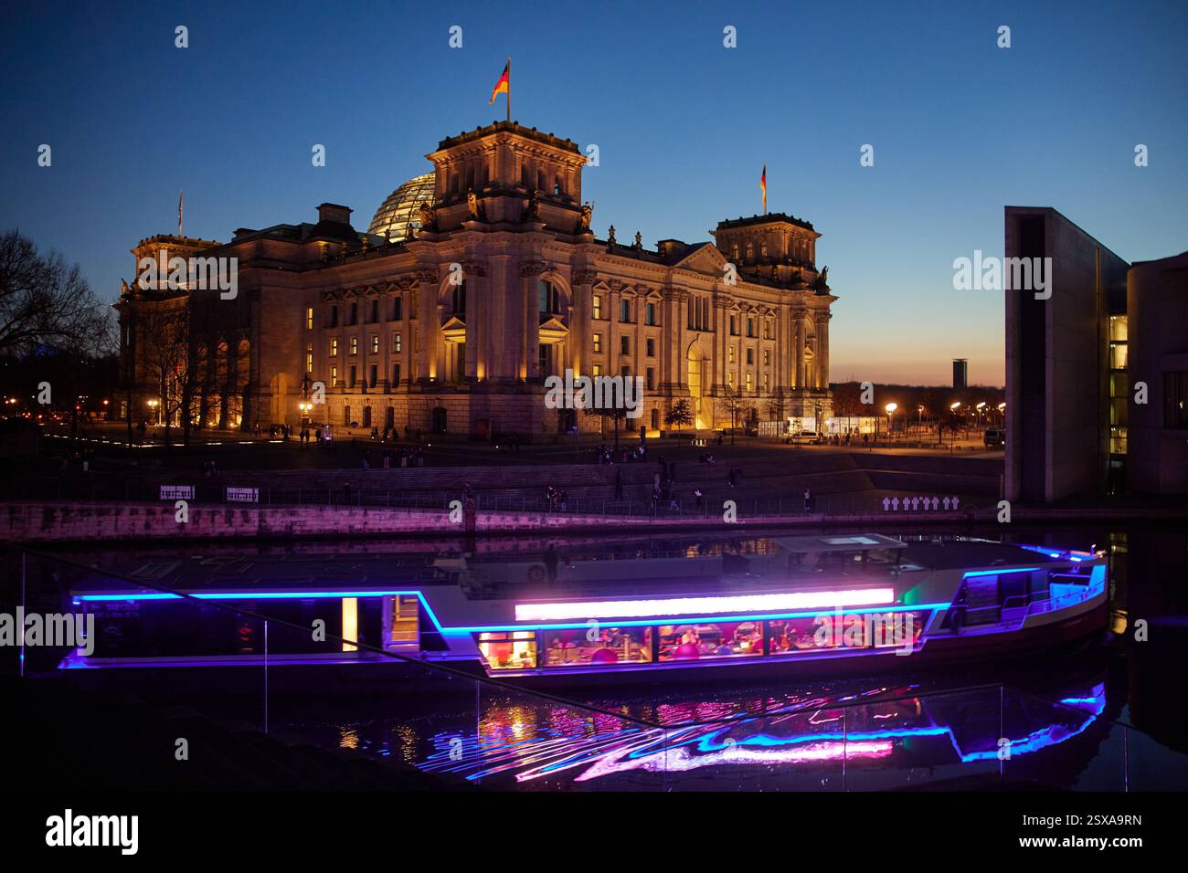 23 February 2025, Berlin: Early evening view of the Reichstag building ...