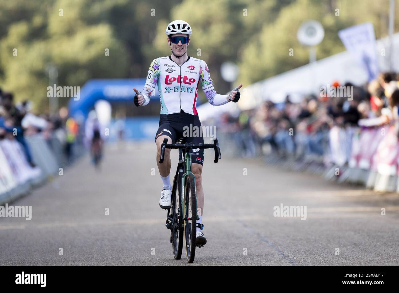 Belgian Jens Adams crosses the finish line of the men's elite race at ...