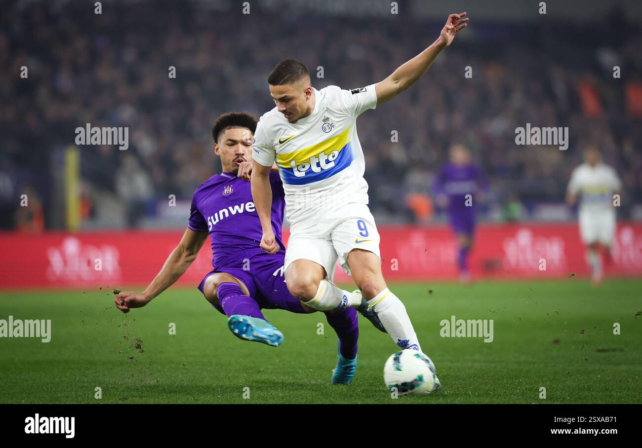 Anderlecht, Belgium. 23rd Feb, 2025. Anderlecht's Adryelson and Union's Franjo Ivanovic fight ...