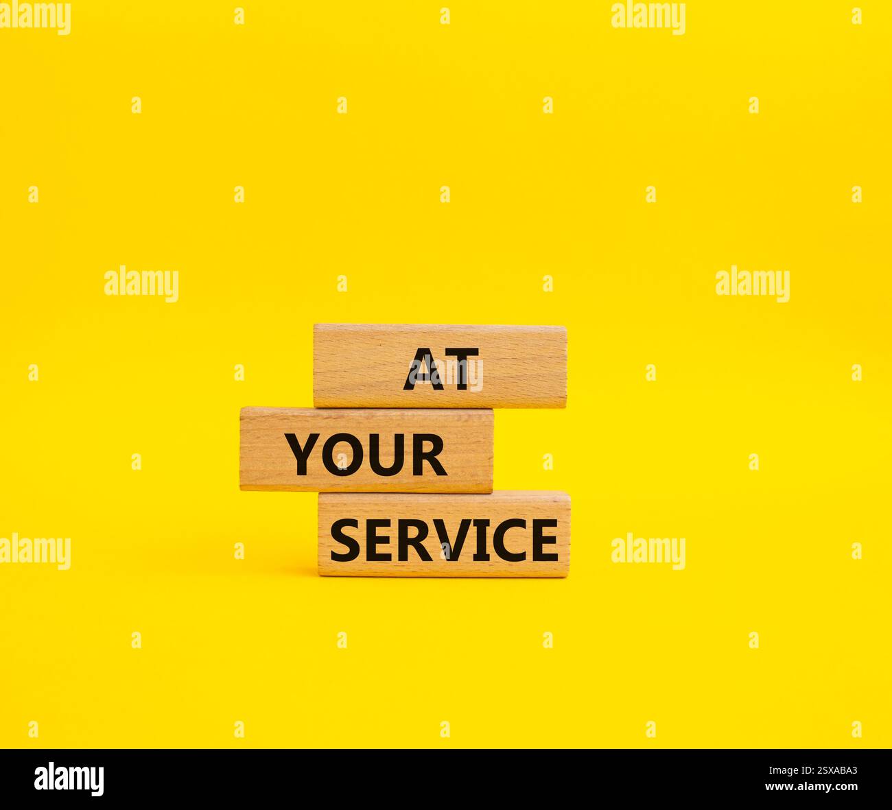At your service symbol. Wooden blocks with words At your service ...