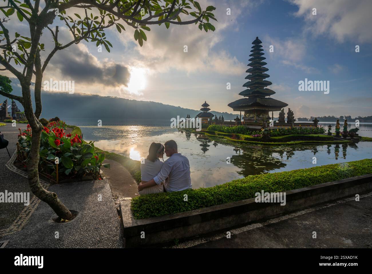 View of young couple viewing Ulun Danu Beratan temple on Lake Bratan at ...