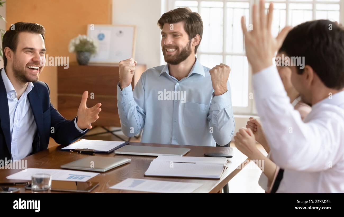 Group of businesspeople celebrating moment of success during business ...