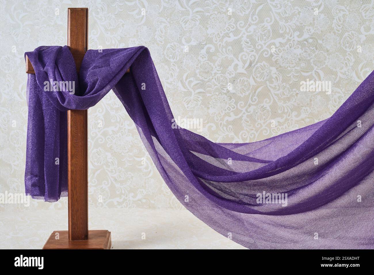 Lenten Cross and Purple Cloth. Elegant Cross Display Stock Photo - Alamy