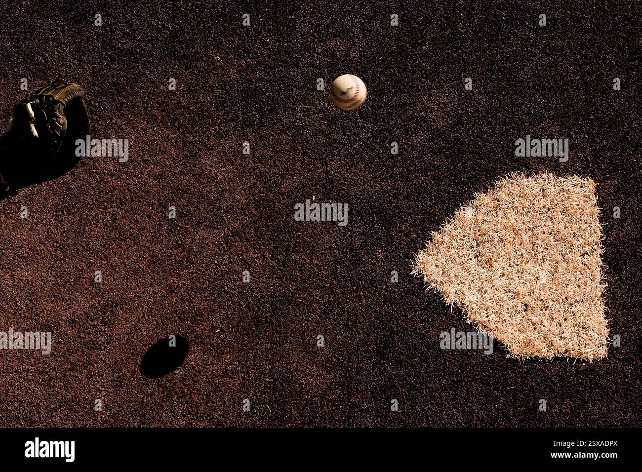 A San Francisco Giants catcher puts a glove out to catch a ball in the ...