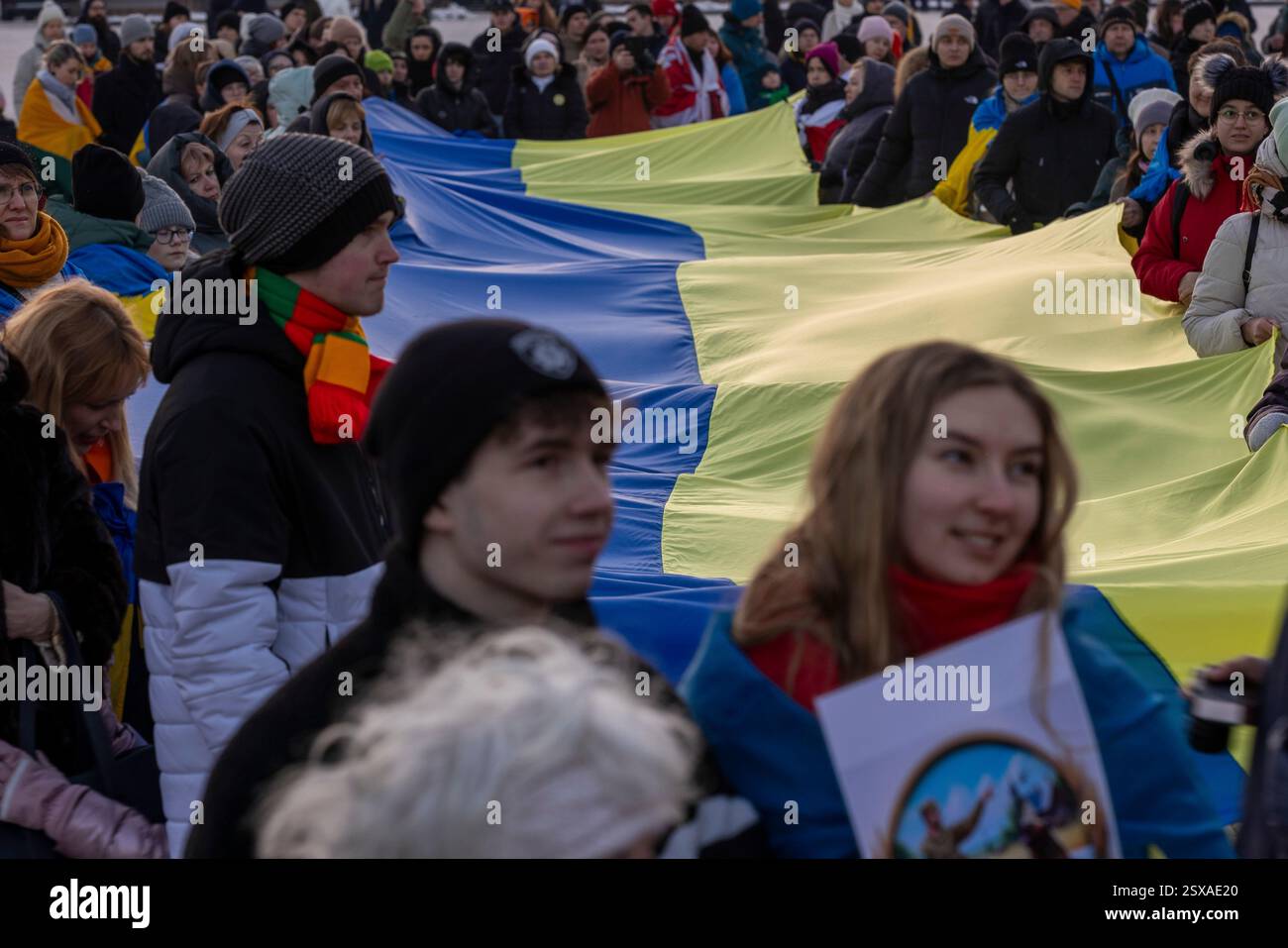 People attend a demonstration against Russia's war on Ukraine to mark ...