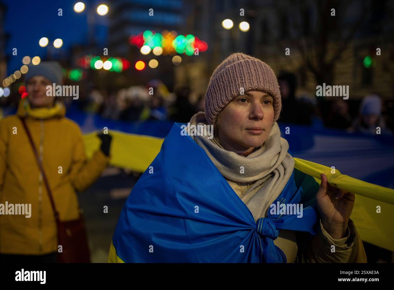 People attend a demonstration against Russia's war on Ukraine to mark ...