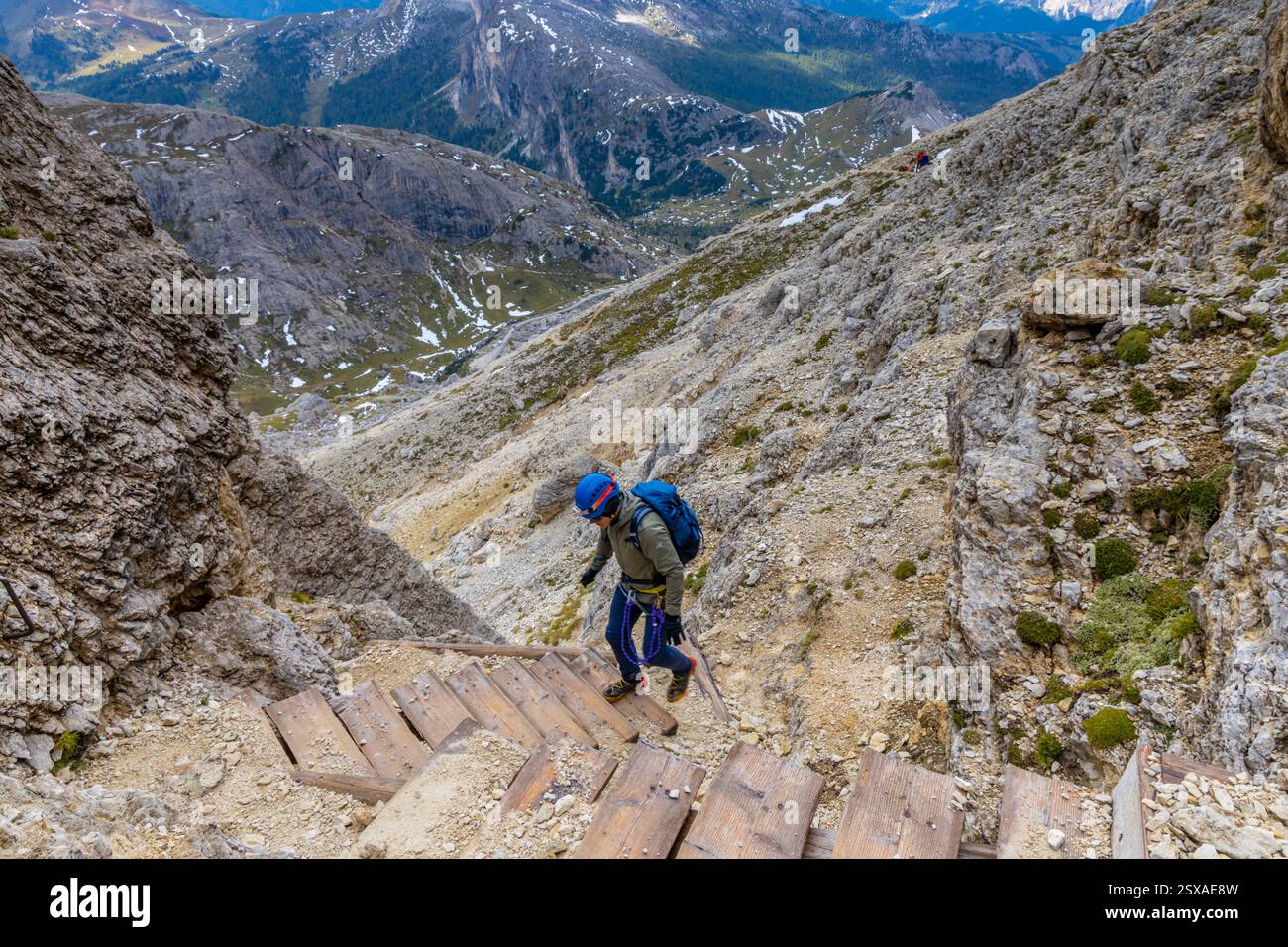 Alpine climber on Via Ferrata metal wire equipped route in the Alps ...