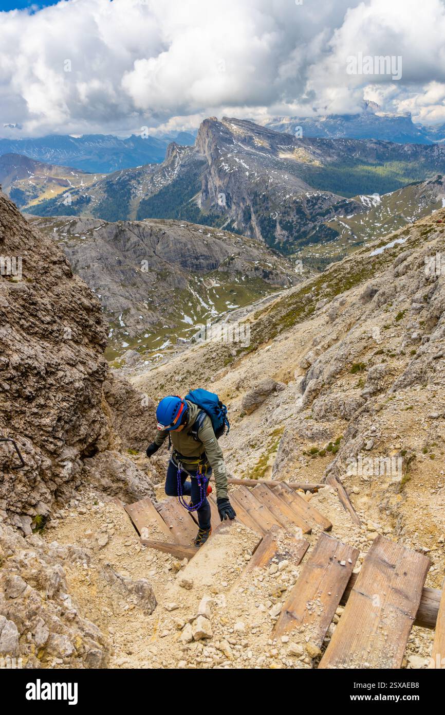 Alpine climber on Via Ferrata metal wire equipped route in the Alps ...