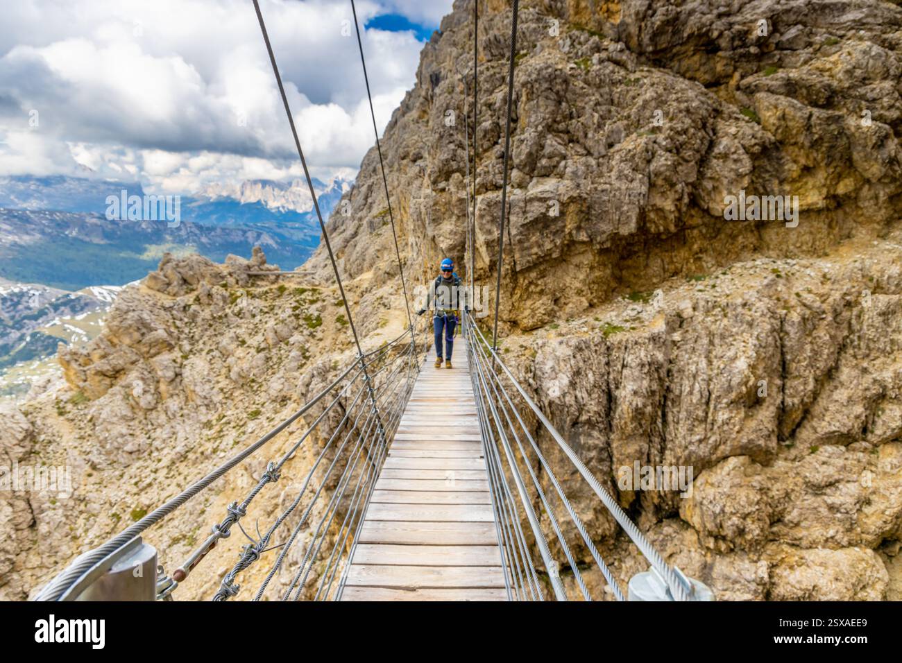 Alpine climber on Via Ferrata metal wire equipped route in the Alps ...