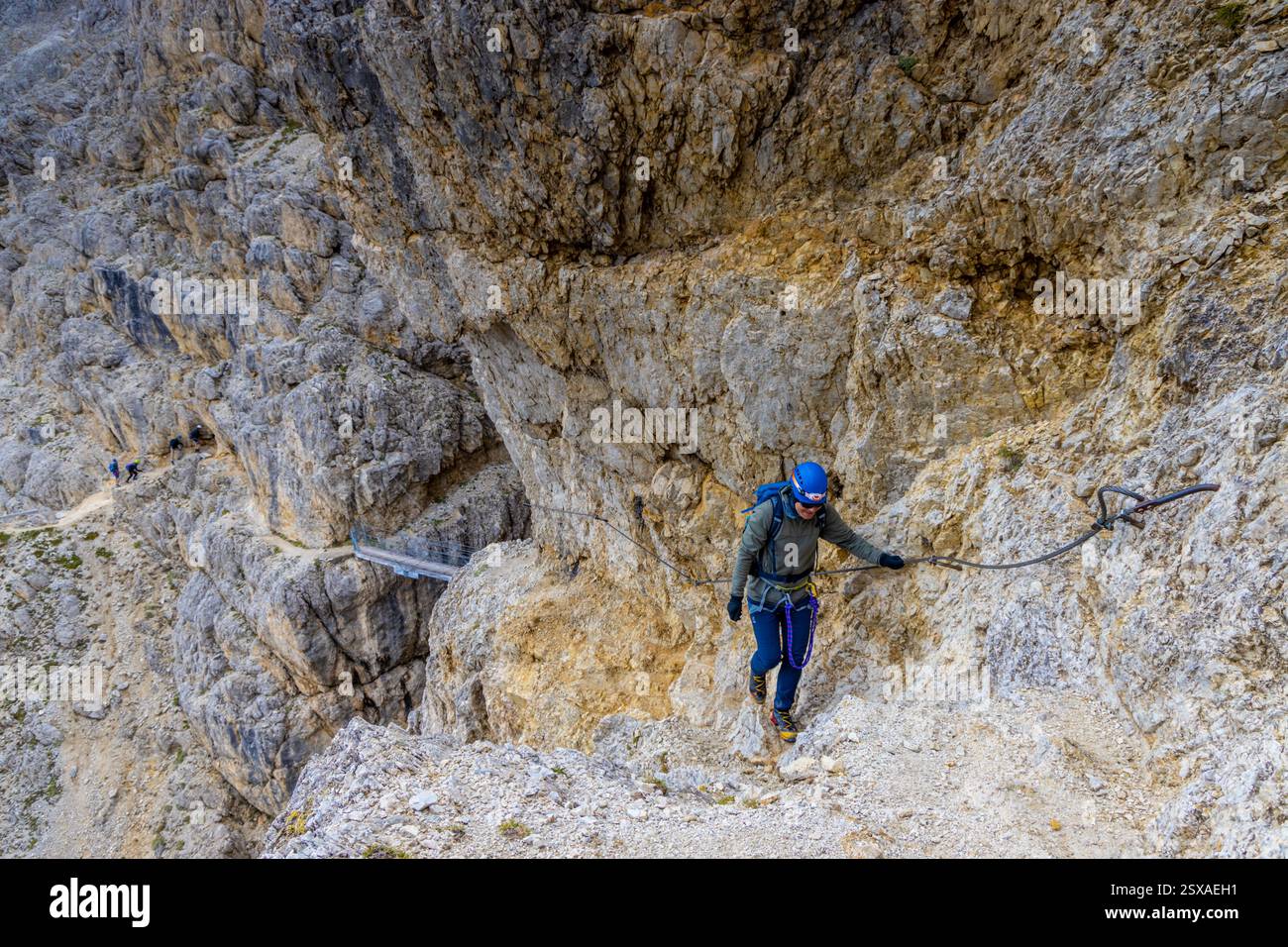 Alpine climber on Via Ferrata metal wire equipped route in the Alps ...