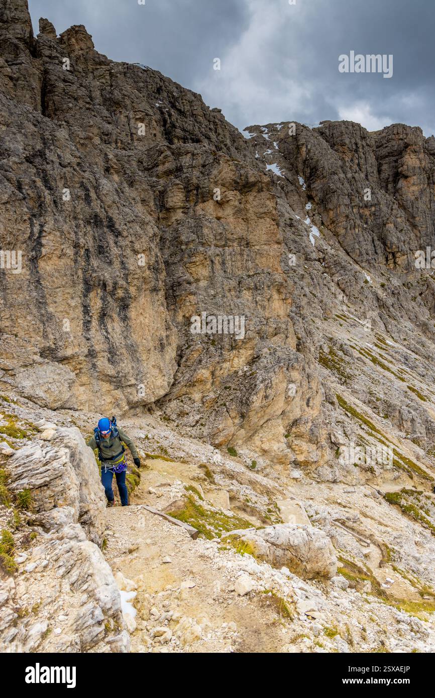 Alpine climber on Via Ferrata metal wire equipped route in the Alps ...